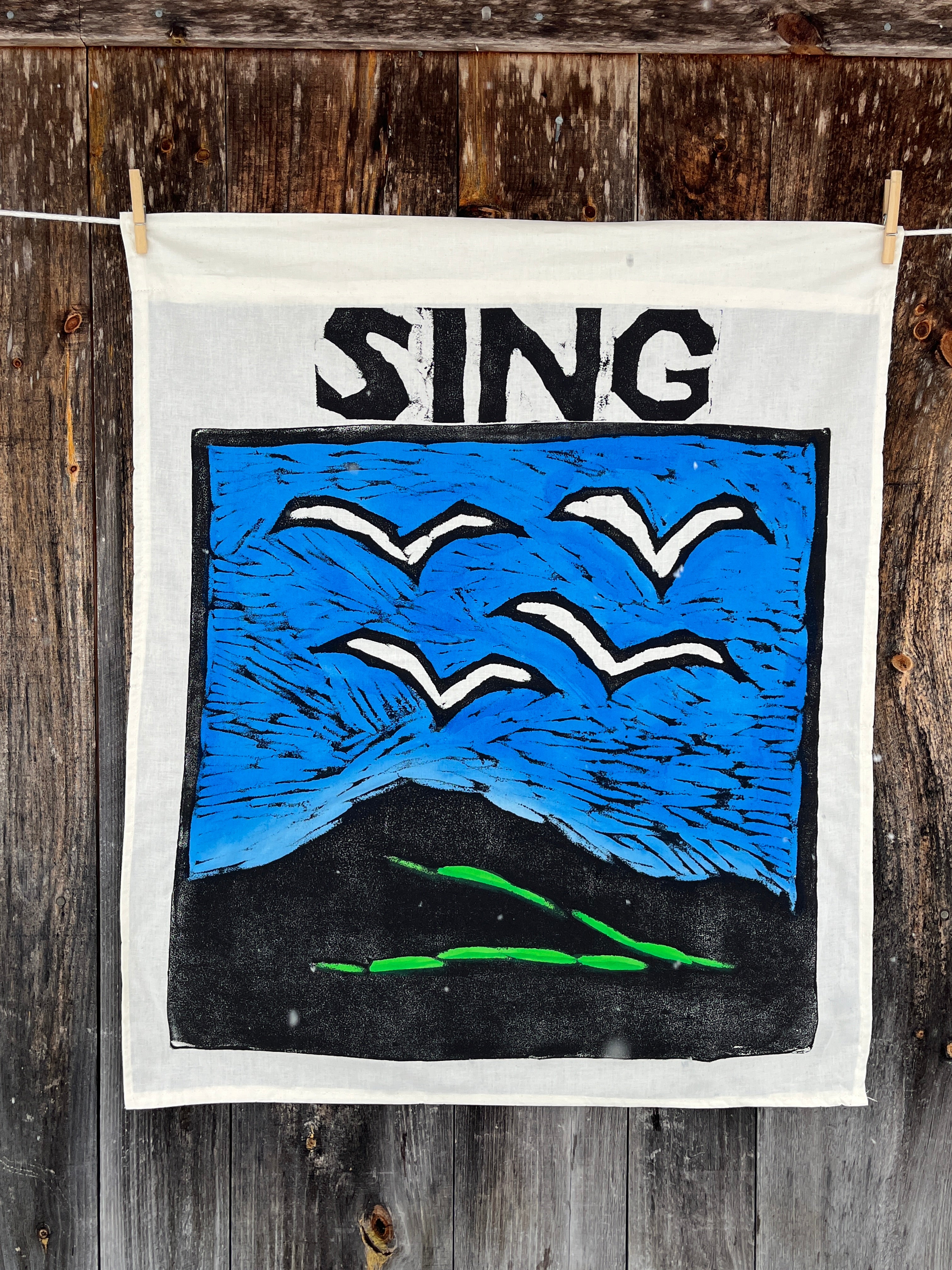 Sing Birds and Hill Banner – Bread + Puppet Press